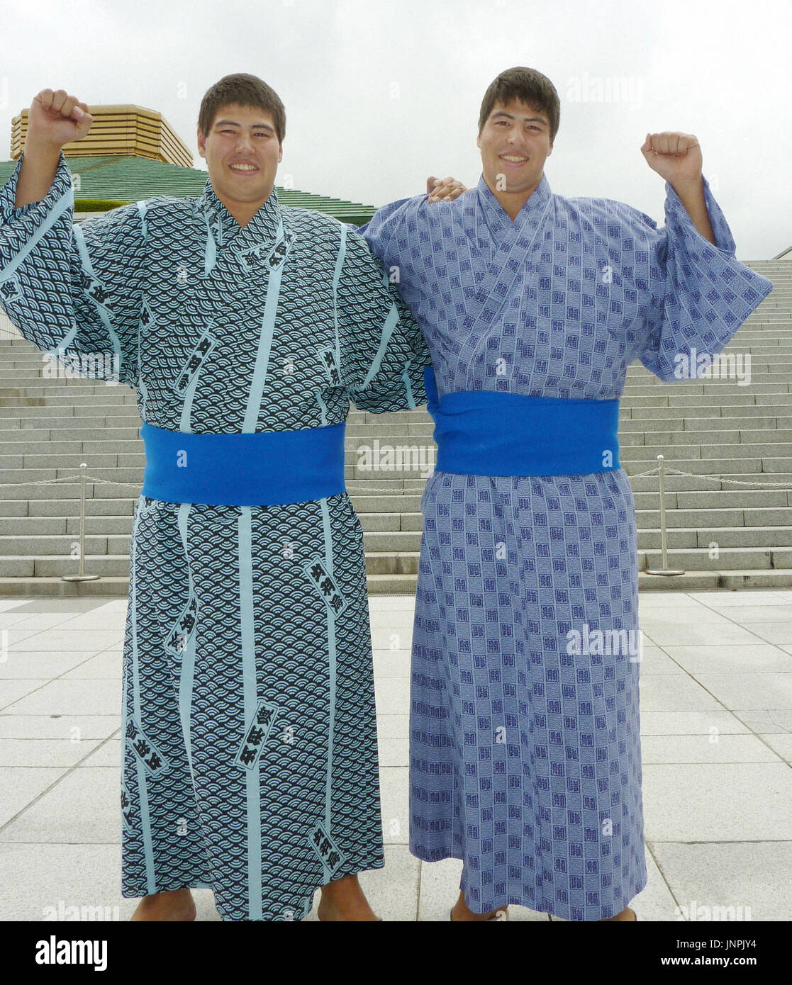 TOKYO, Japan - Twin brothers Jun Saito (R) and Rei pose in front of ...