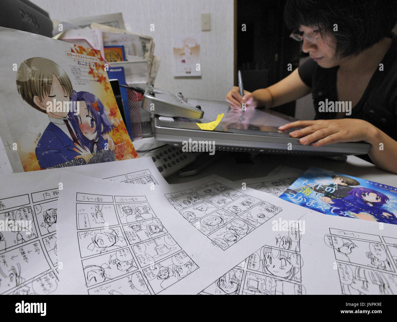 TOKYO, Japan - Comic artist Okosama Ranchi draws pictures using a ...