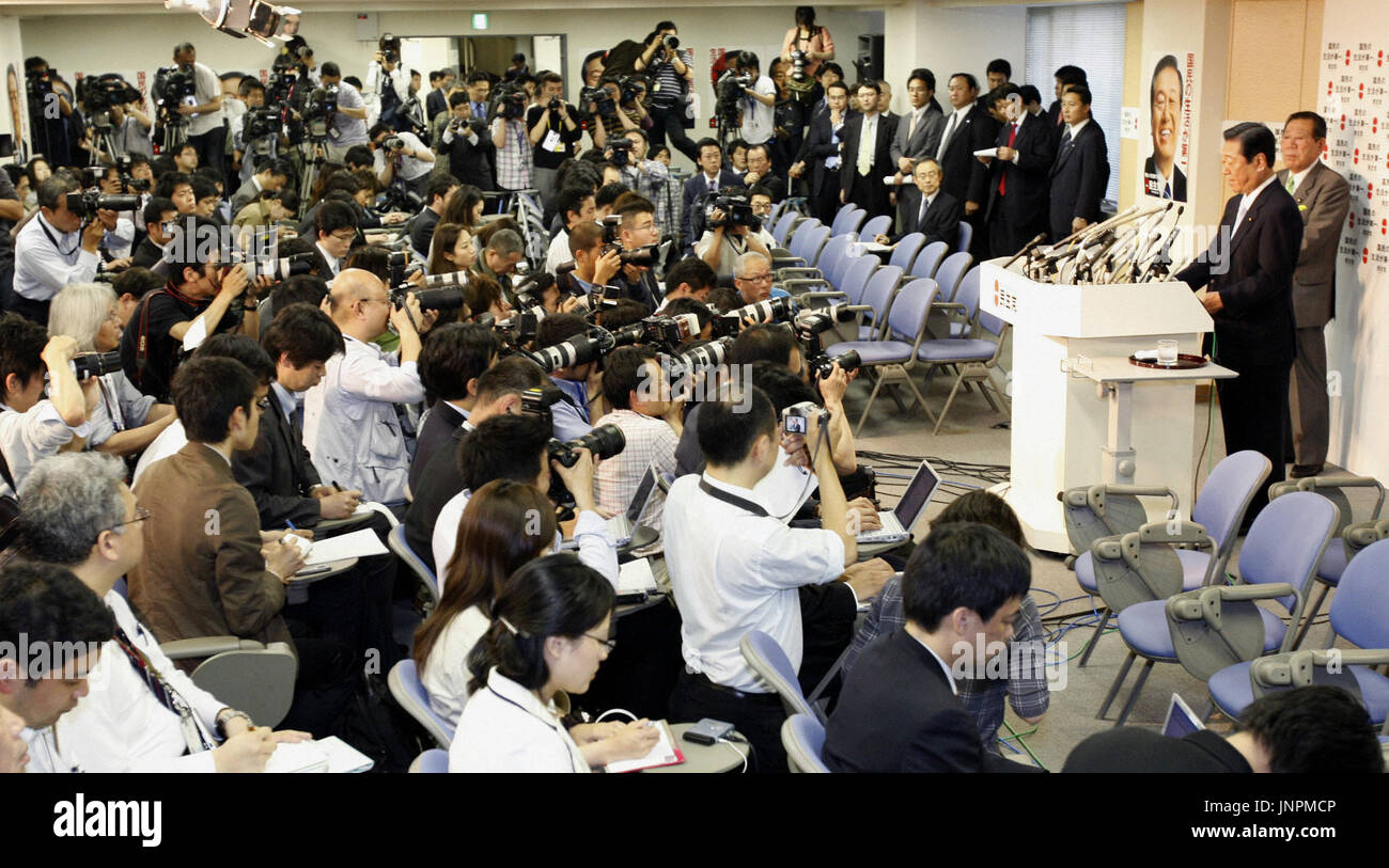 TOKYO, Japan - Opposition leader Ichiro Ozawa speaks at a press conference before a throng of ...