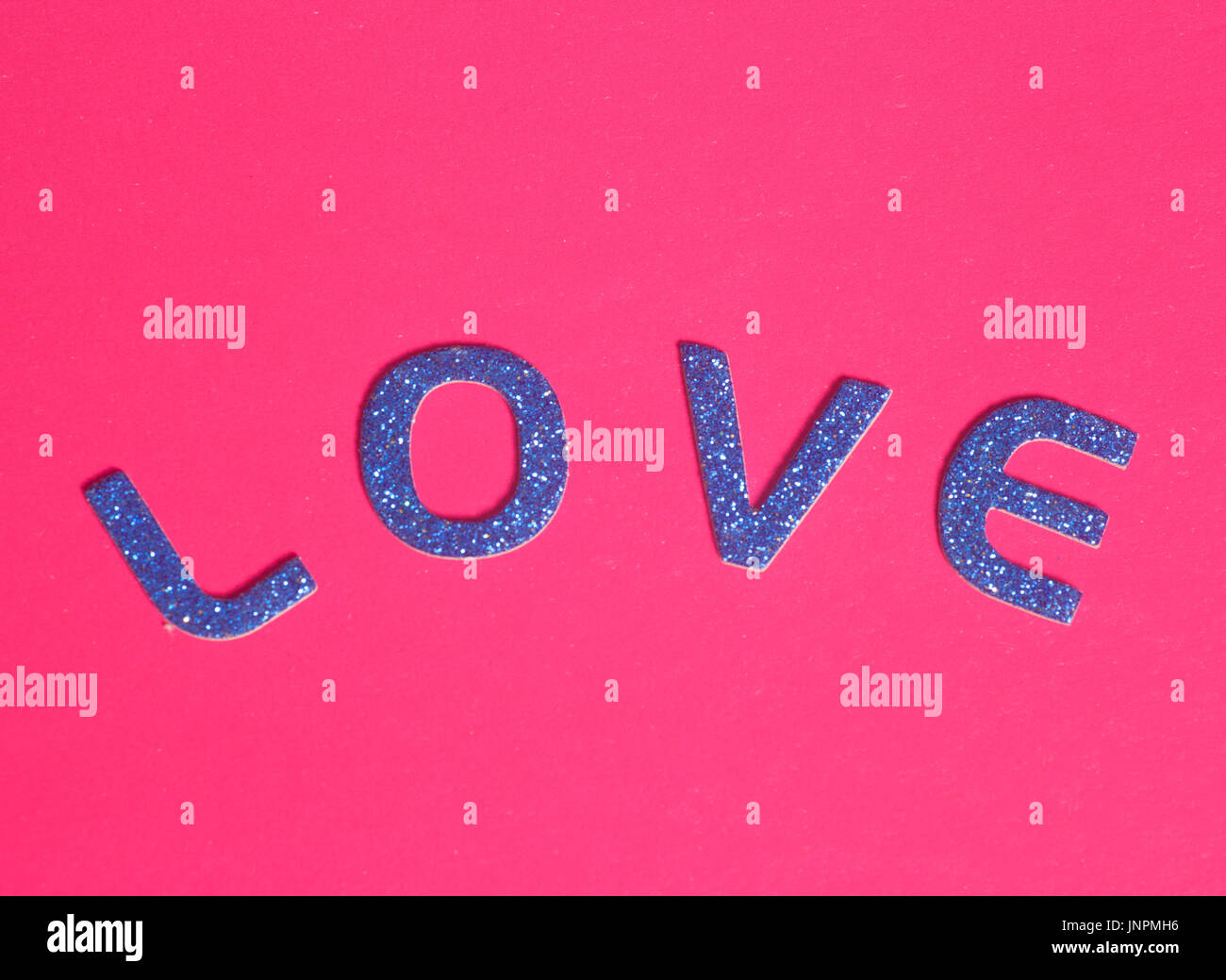 Shiny blue letters forming the word love Stock Photo - Alamy