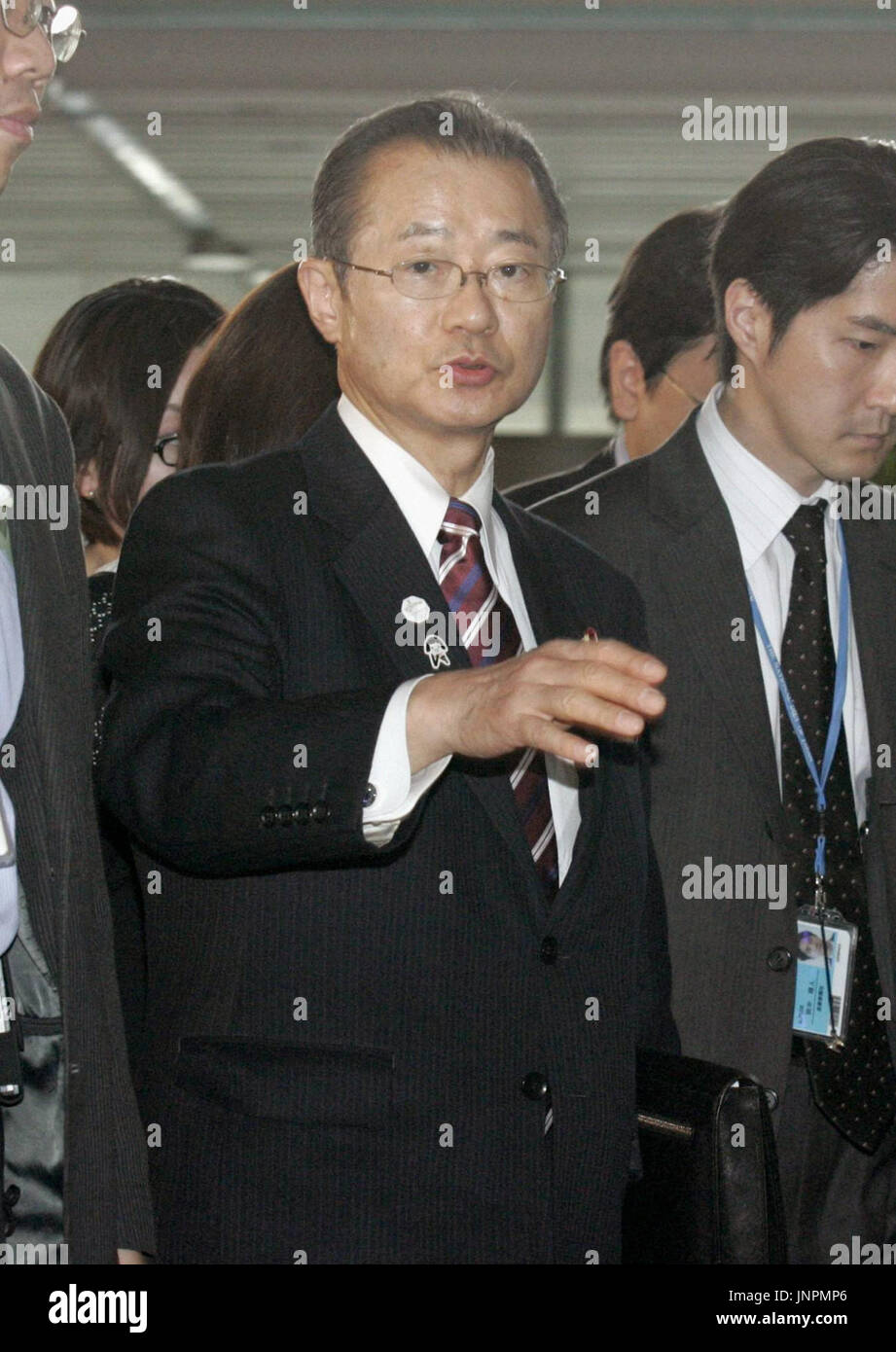 TOKYO, Japan - Chief Cabinet Secretary Takeo Kawamura heads to the ...