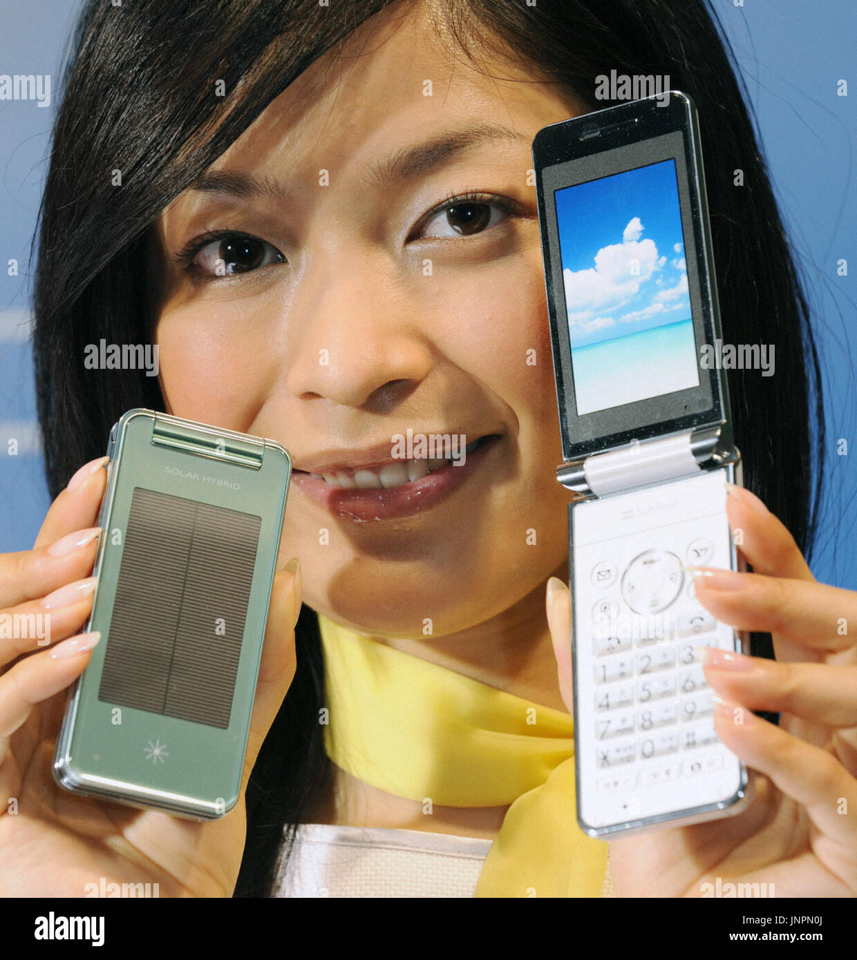 TOKYO, Japan - A model shows off cellphones rolled out by Softbank ...