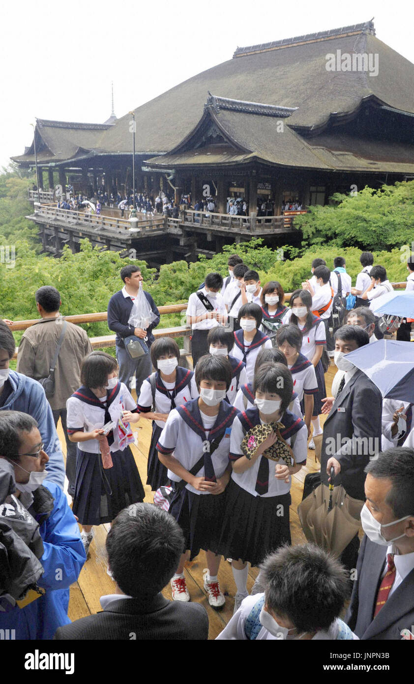 KYOTO, Japan - Students wear face masks as they visit the popular ...