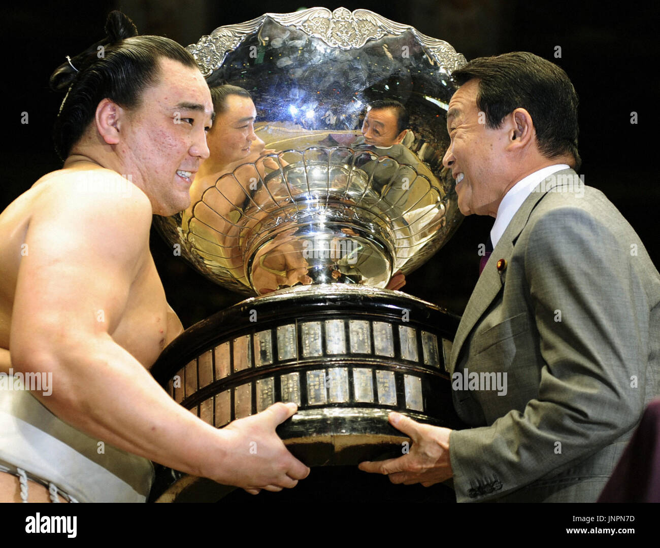 TOKYO, Japan - Ozeki Harumafuji (L), who captured his first career title at the Summer Grand ...