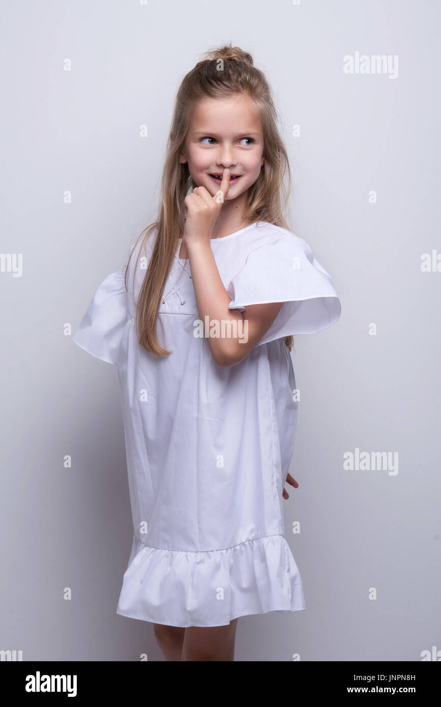 Cute little fashion model on white background. Beautiful girl studio ...