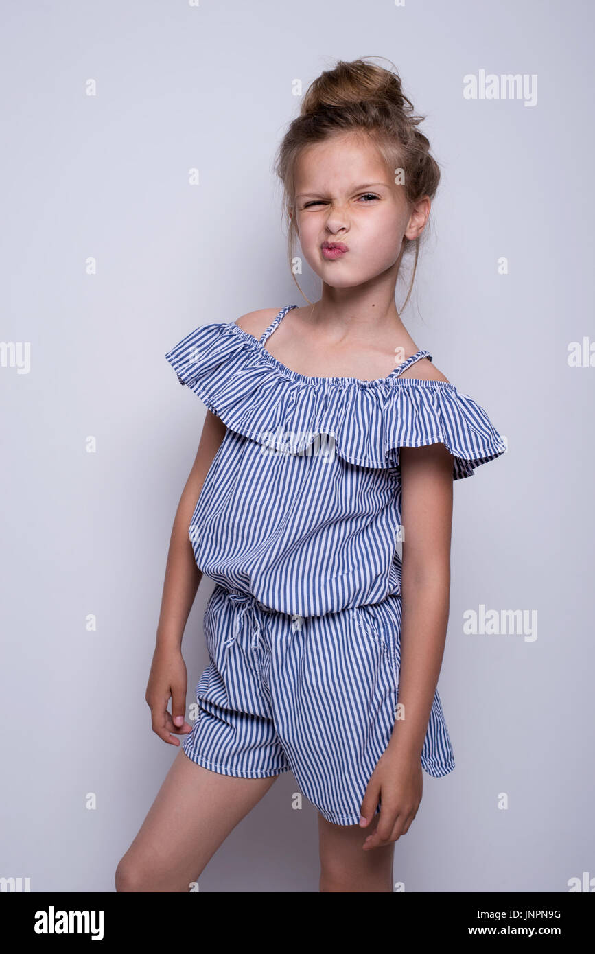 Beautiful little fashion model on white background. Portrait of cute ...