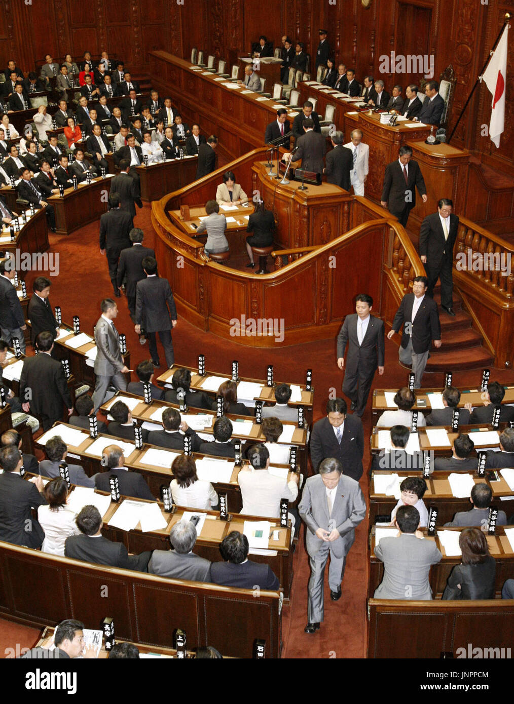 TOKYO, Japan - Members of Japan's lower house vote on June 18 on a bill ...