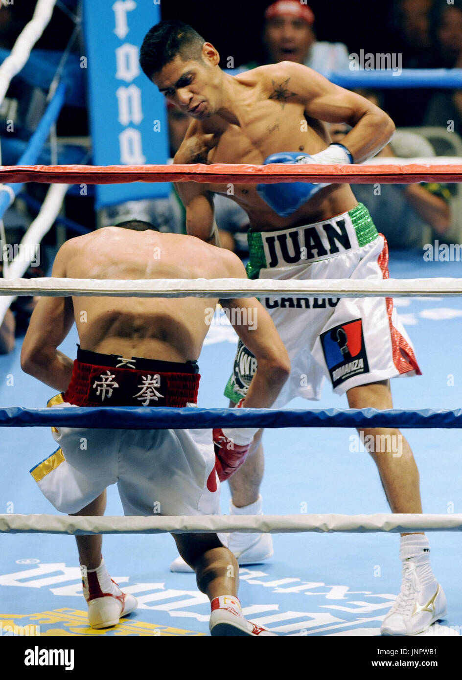 TOKYO, Japan - Mexican challenger Juan Carlos Salgado lands a punch on ...