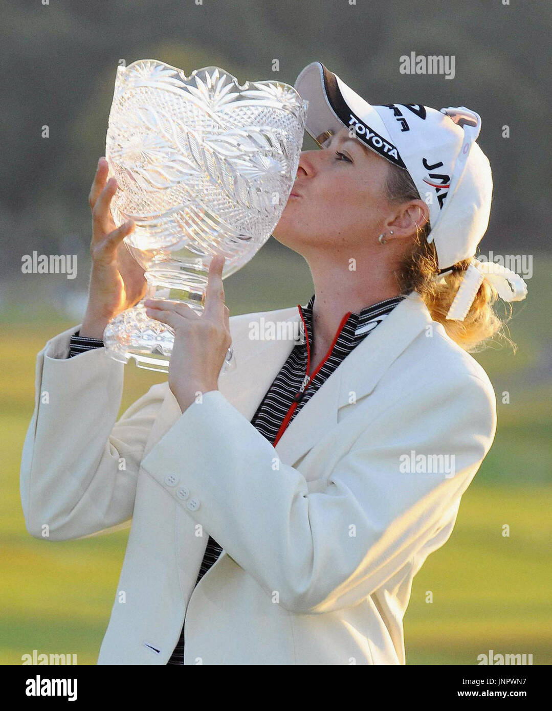 TOKYO, Japan - Australian Nikki Campbell kisses the winner's trophy ...