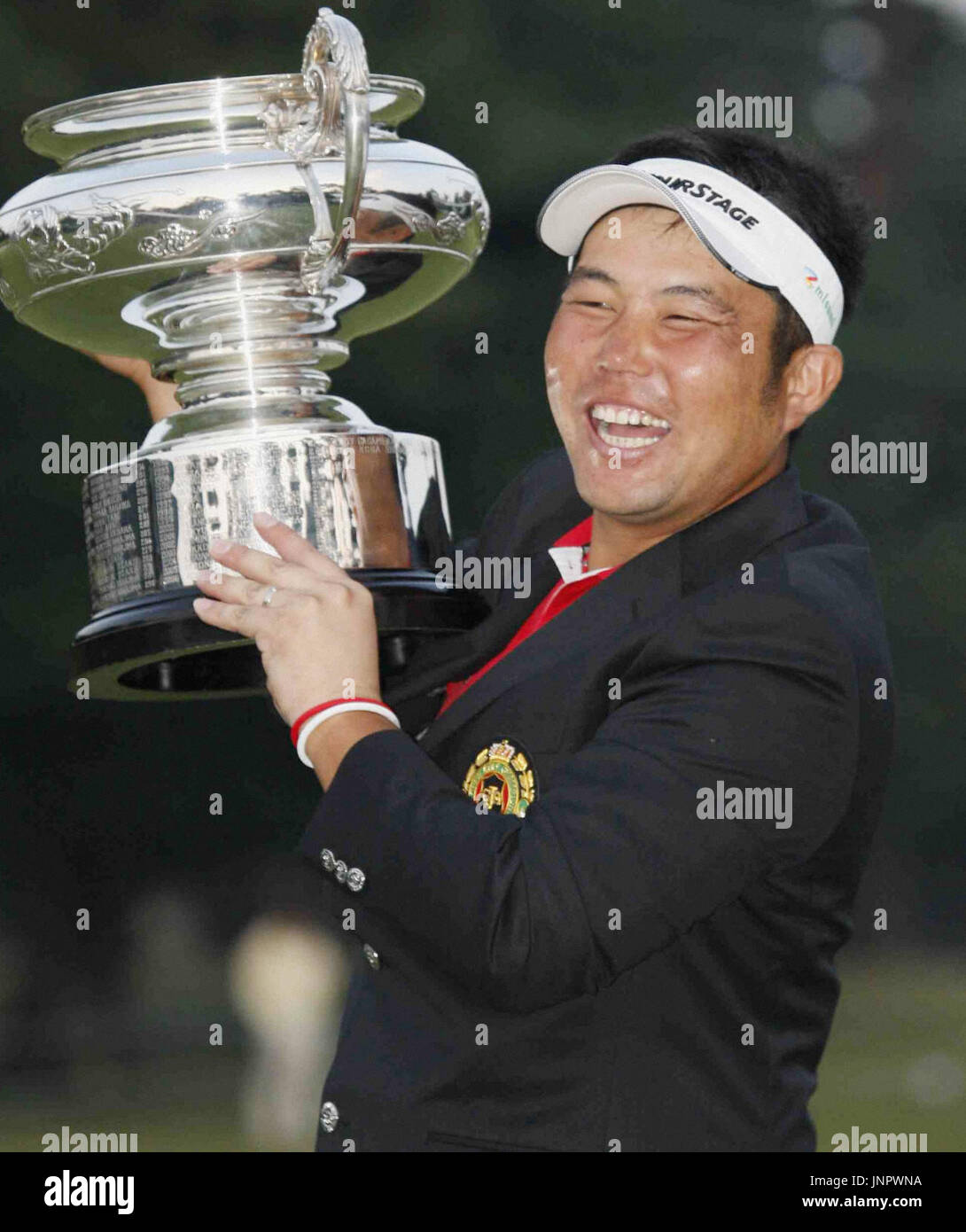 IRUMA, Japan - Ryuichi Oda poses with the winner's trophy after his ...