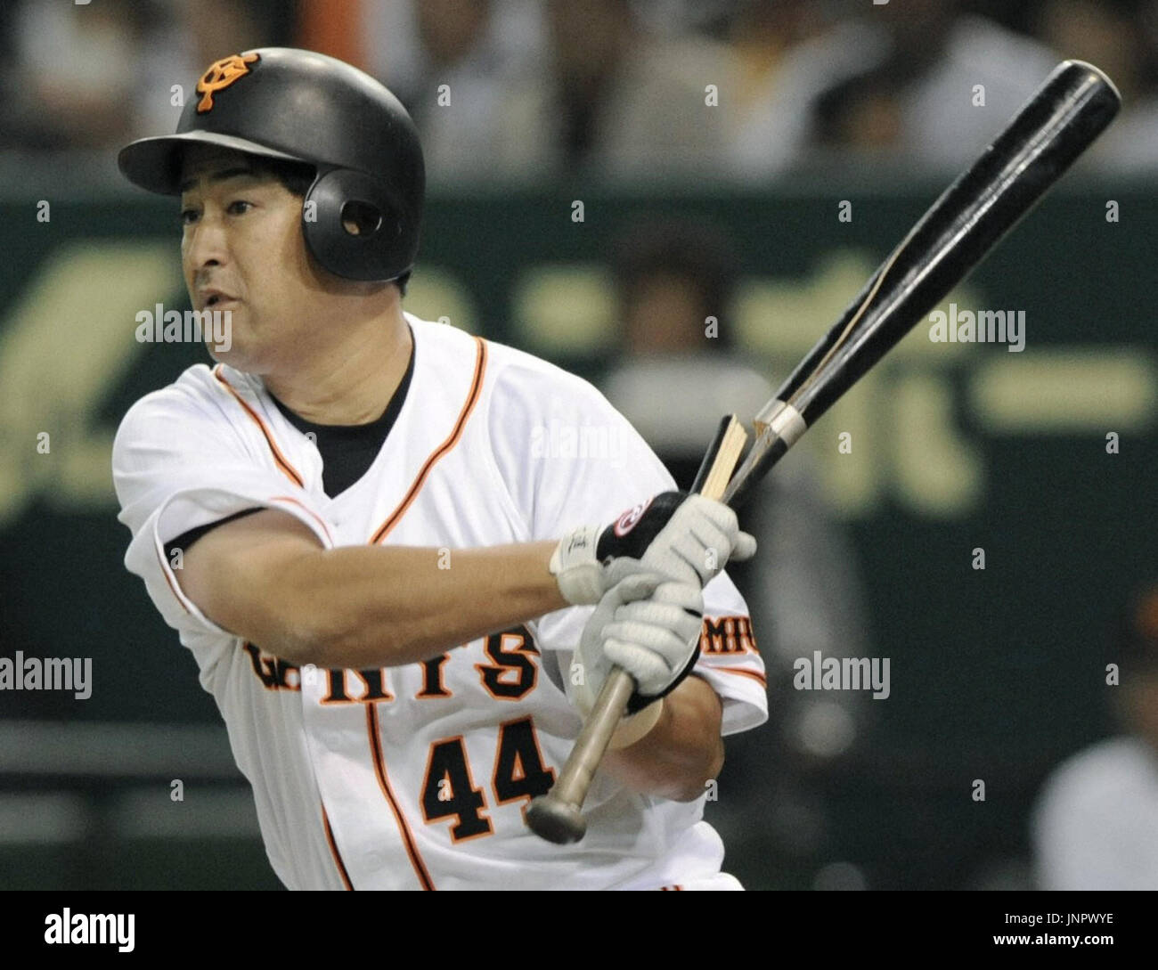 TOKYO, Japan - Pinch-hitter Noriyoshi Omichi strikes a two-run double ...