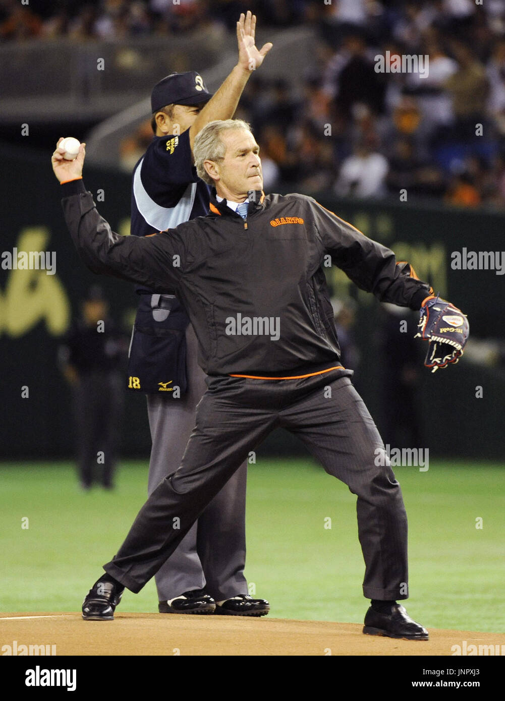 TOKYO, Japan - Former U.S. President George W. Bush throws the ...