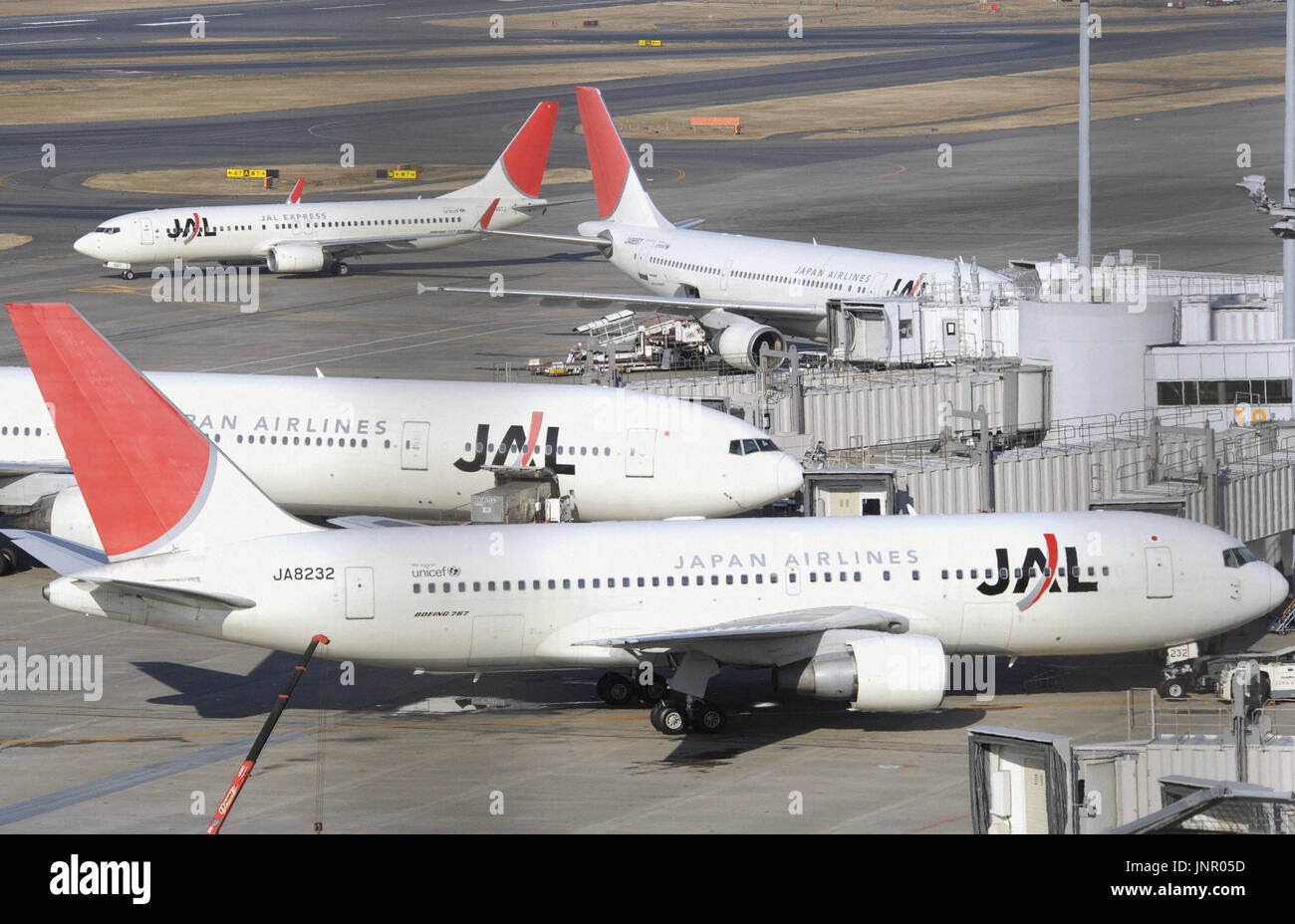TOKYO, Japan - Japan Airlines Corp. planes park at Tokyo's Haneda ...