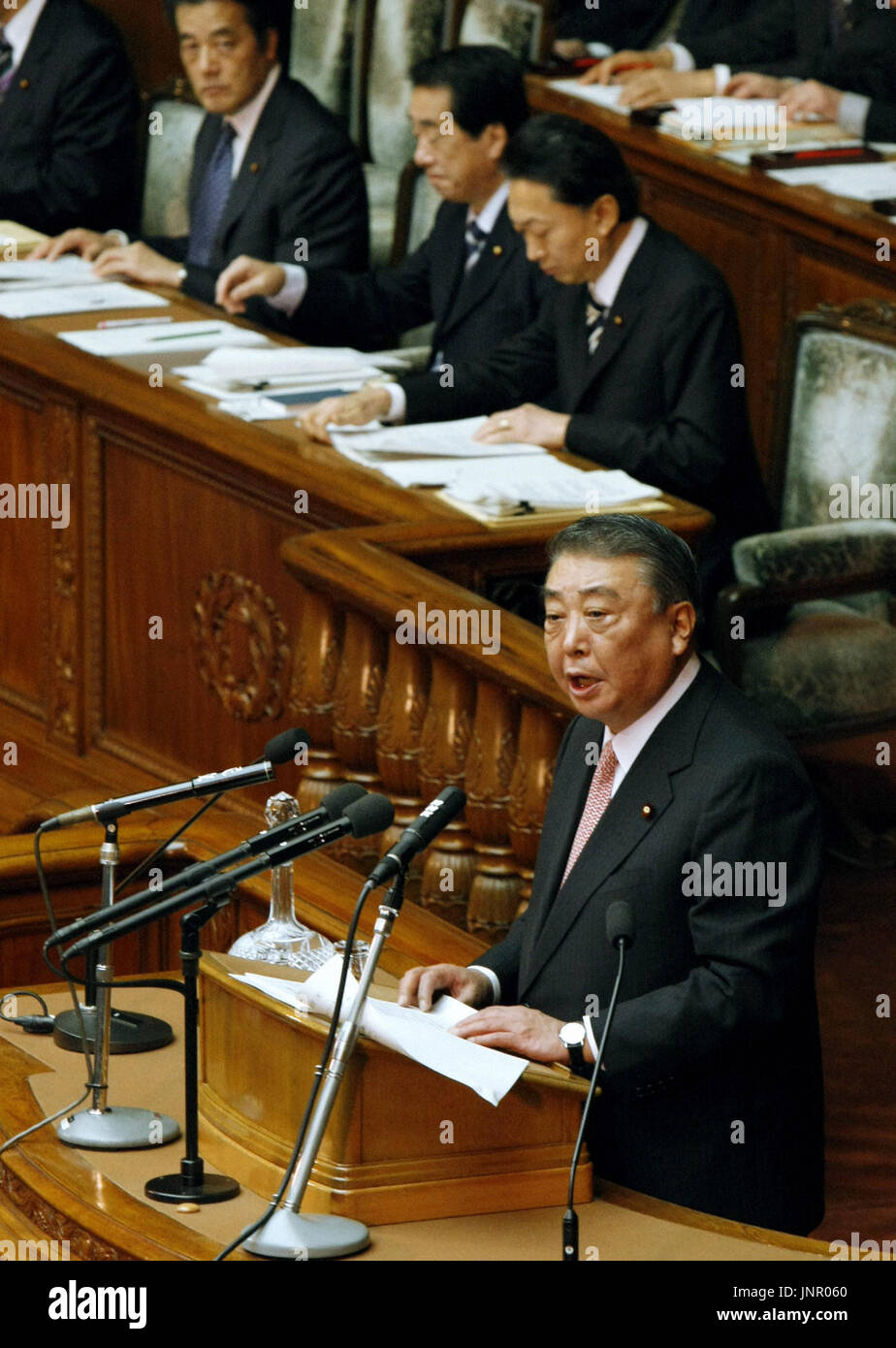 TOKYO, Japan - Tadamori Oshima (front), secretary general of the main ...