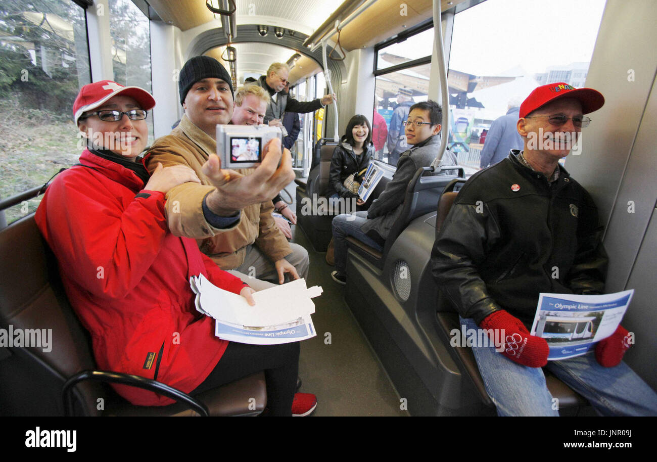 VANCOUVER, Canada - People ride an Olympic Line streetcar in Vancouver ...