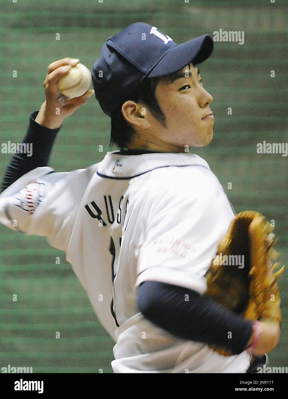 NICHINAN, Japan - Seibu Lions rookie Yusei Kikuchi pitches a ball ...