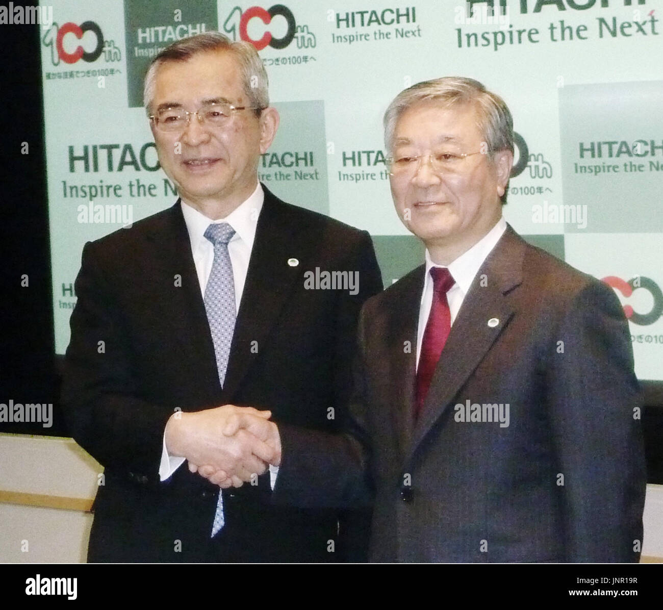 TOKYO, Japan - Takashi Kawamura (L), chairman and president of Hitachi ...