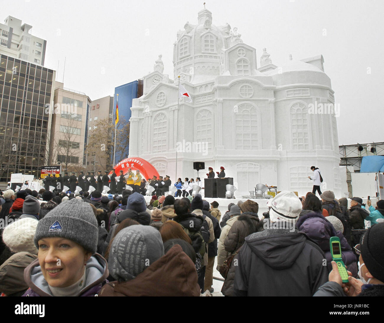 SAPPORO, Japan - People look at a 26-meter-tall snow building of the ...