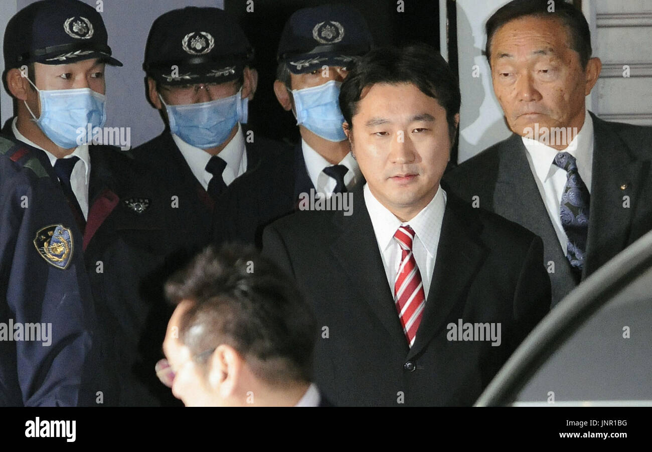 TOKYO, Japan - Democratic Party of Japan lawmaker Tomohiro Ishikawa (C) leaves the Tokyo ...