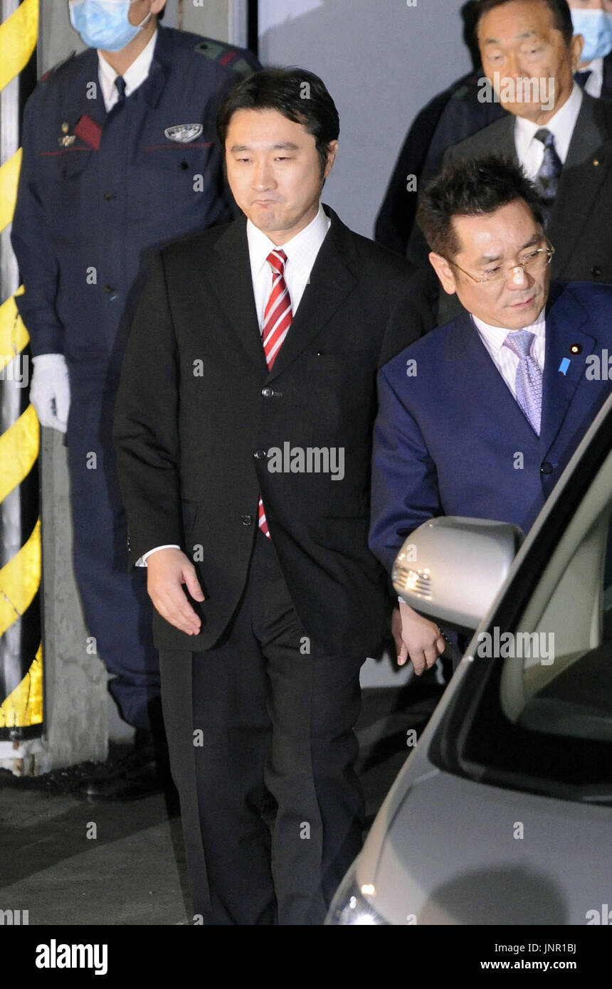 TOKYO, Japan - Democratic Party of Japan lawmaker Tomohiro Ishikawa (C) leaves the Tokyo ...