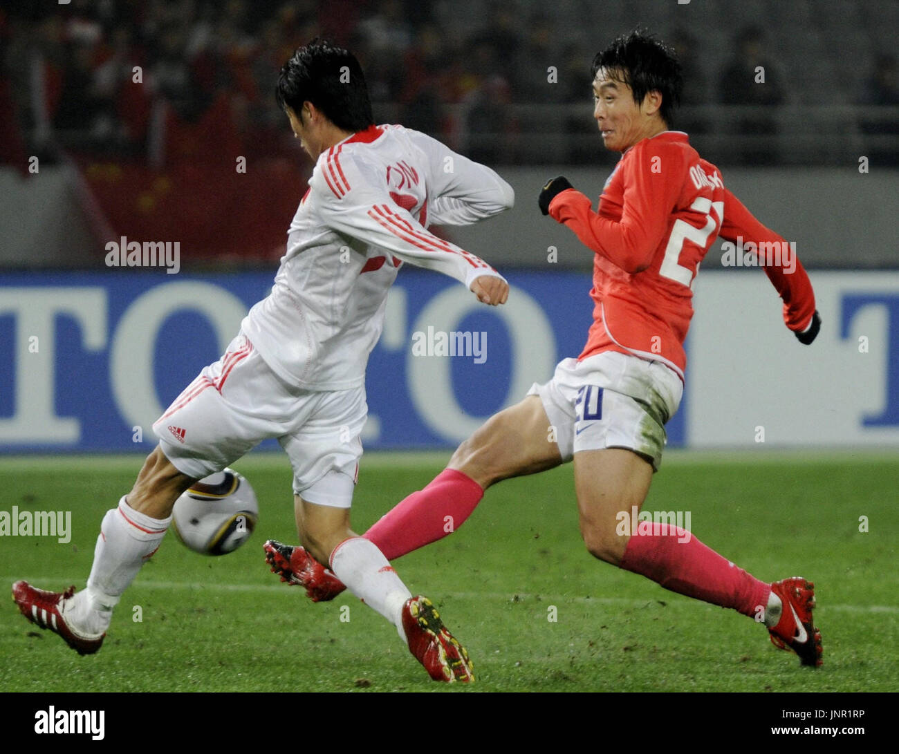 CHOFU, Japan - South Korea forward Lee Dong Gook (R) shoots during the ...