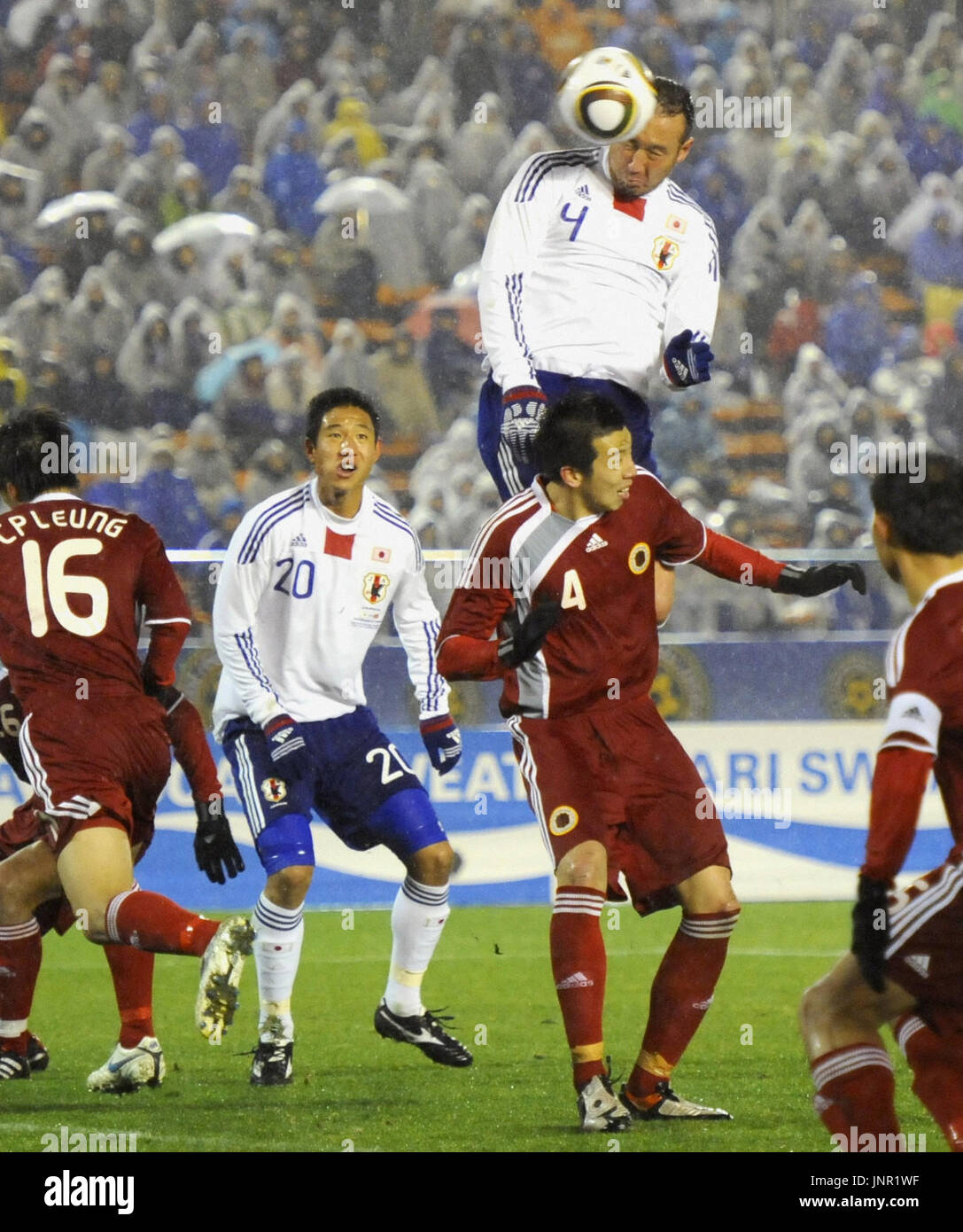 TOKYO, Japan - Japan defense Marcus Tulio Tanaka heads home Japan's ...