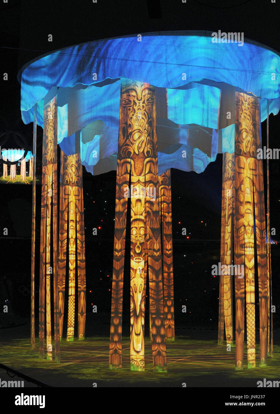VANCOUVER, Canada - Illuminated images of totem poles appear on stage ...