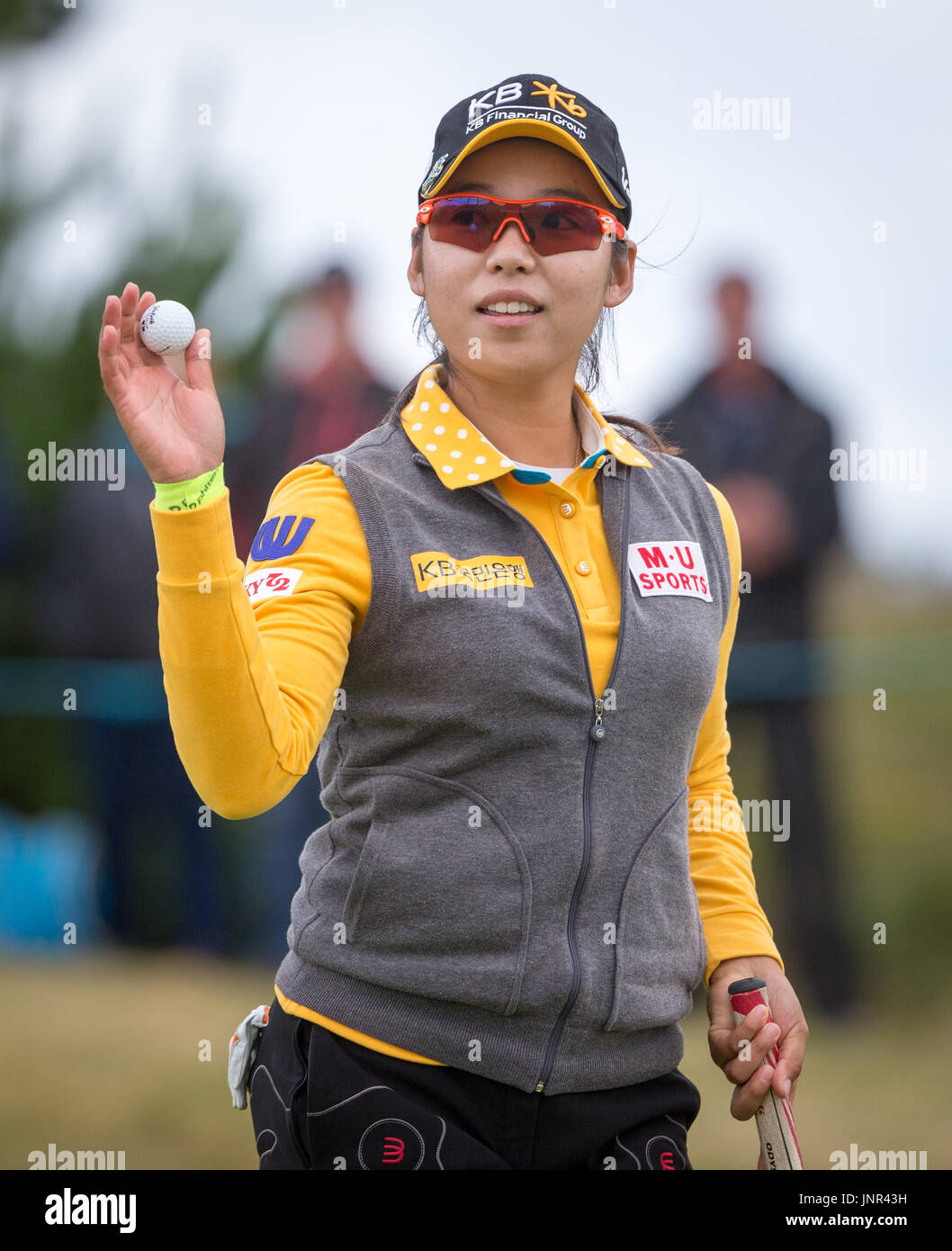 Korea's Mi Hyang Lee acknowledges the fans on the 18th green following ...