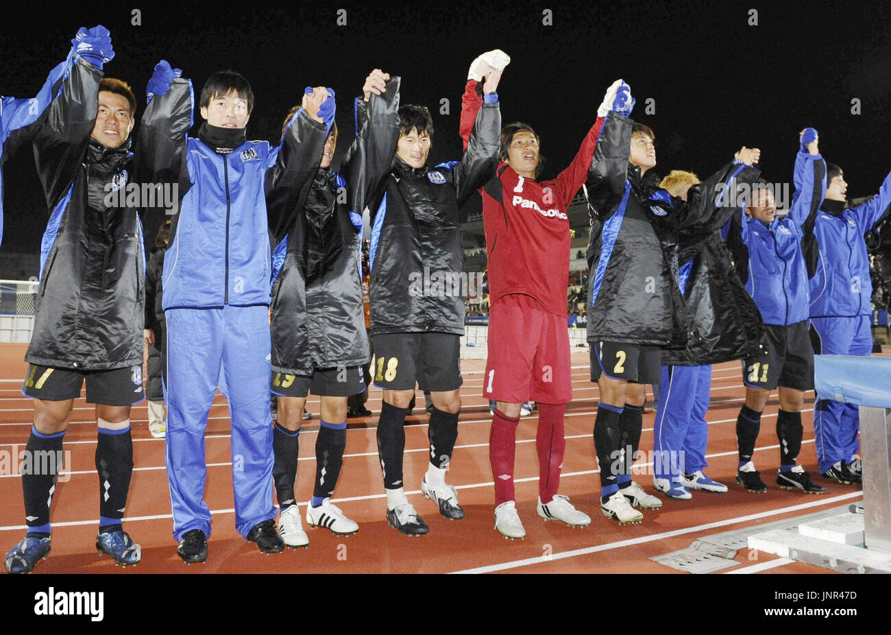 OSAKA, Japan - Japan's Gamba Osaka players wave to fans after beating ...