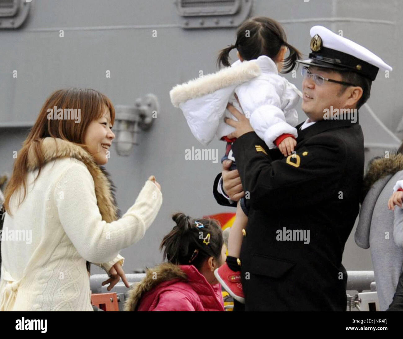 KURE, Japan - A Maritime Self-Defense Force member bids farewell to his ...