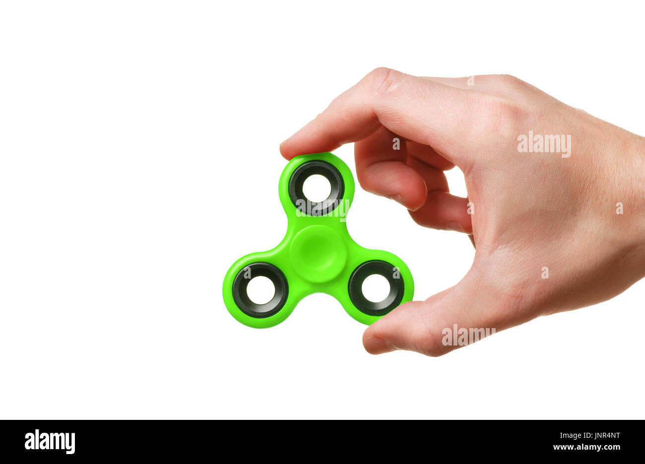 Green hand spinner in man’s hand isolated on white background Stock ...