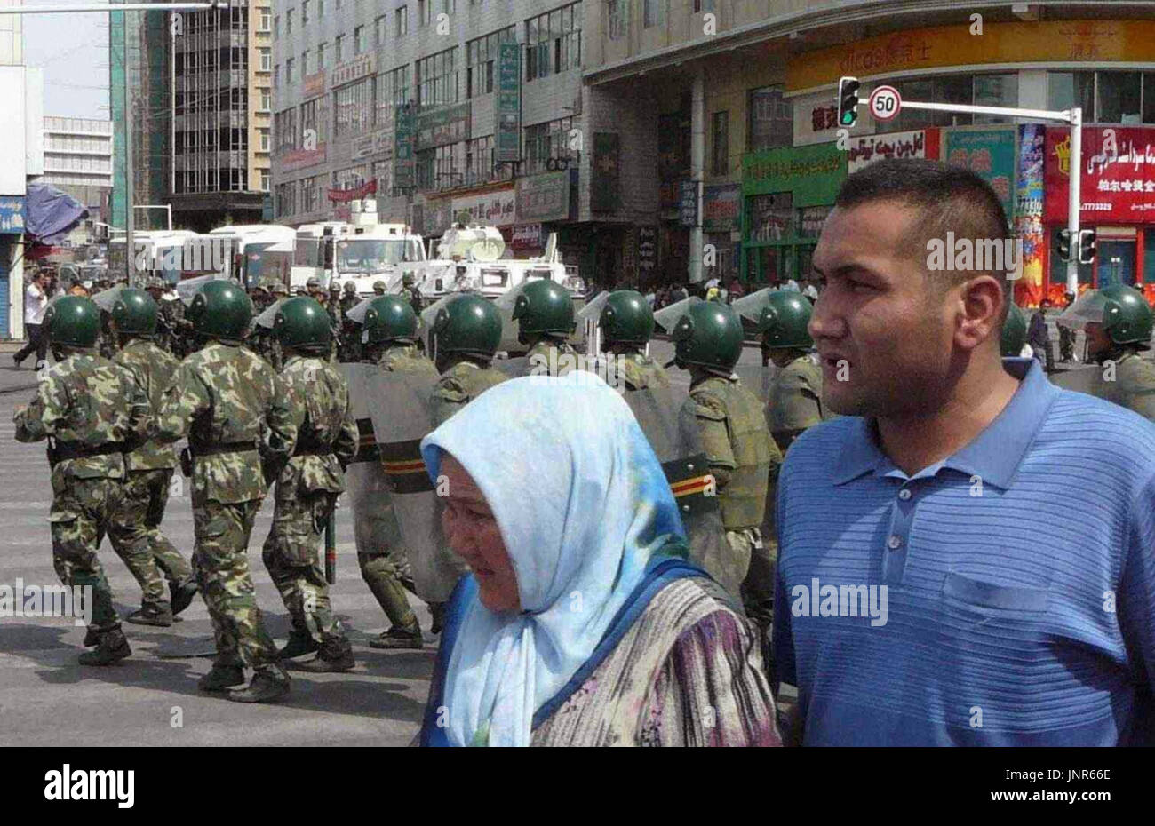 URUMQI, China - Chinese paramilitary police march on a street in Urumqi ...