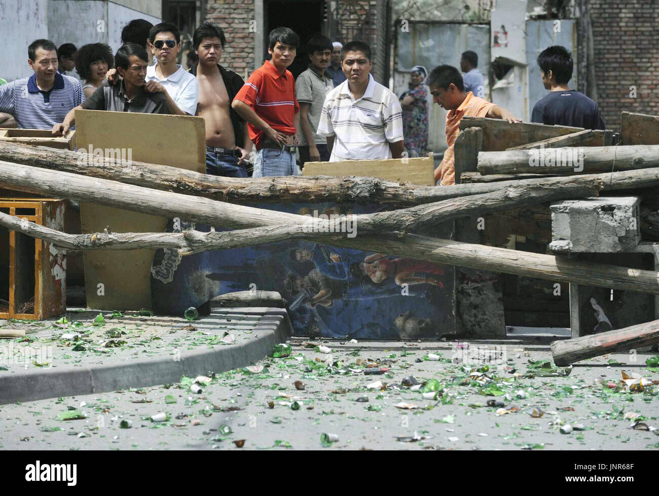 URUMQI, China - Uyghur residents set up a barricade in a residential ...