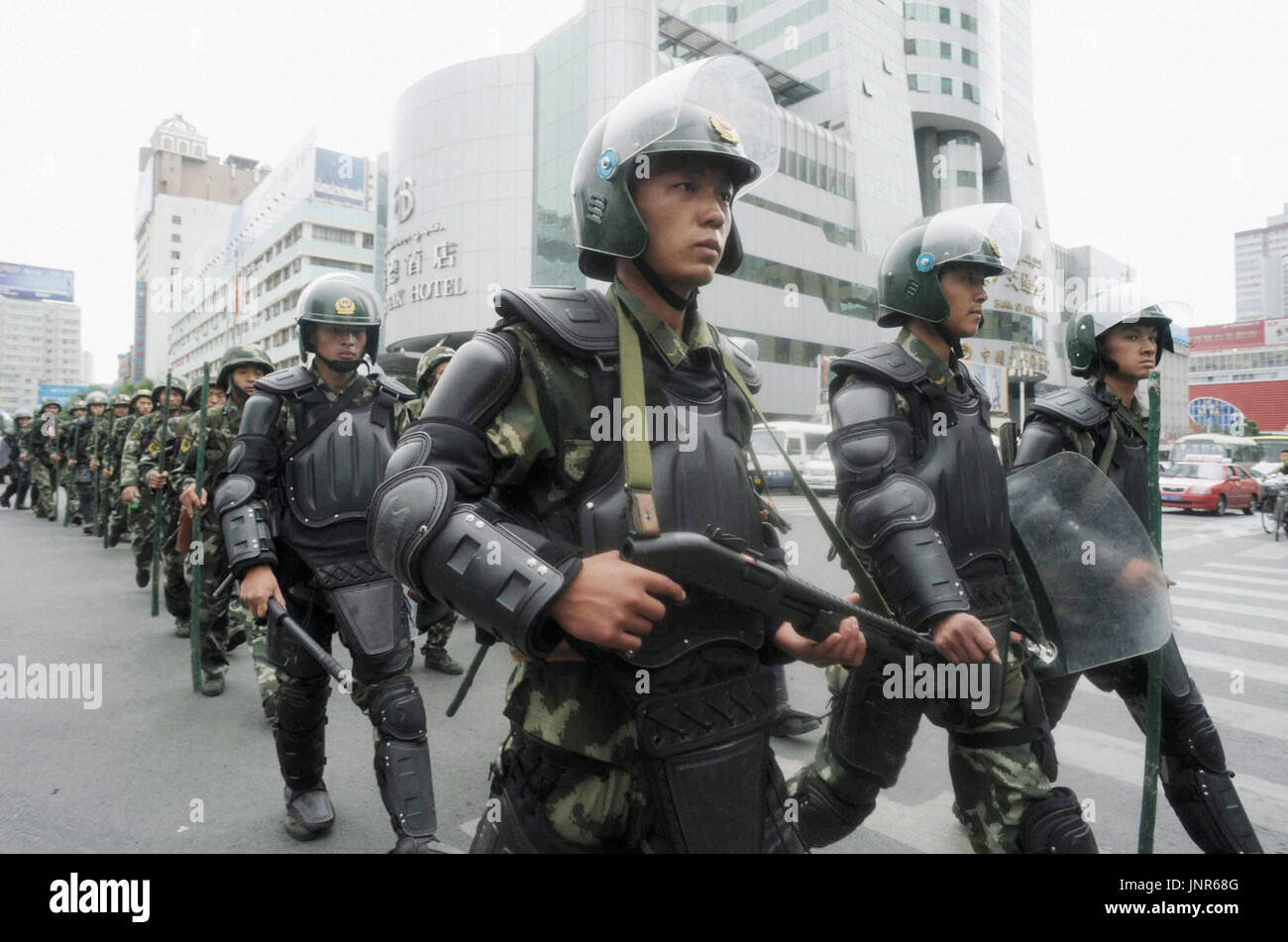 URUMQI, China - Armed police march on a street in Urumqi, the riot-hit ...