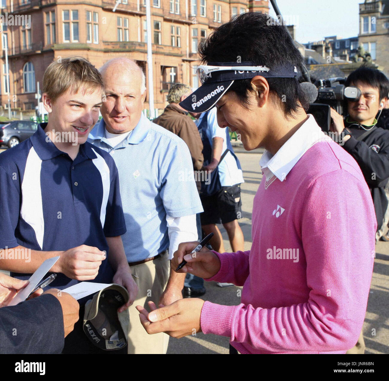 ST. ANDREWS, Scotland - Japanese teenage golfer Ryo Ishikawa signs his ...