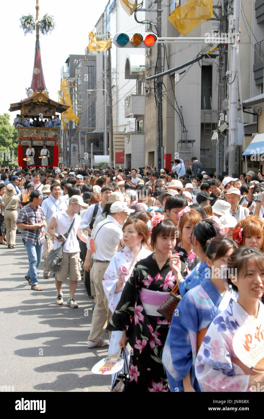 KYOTO, Japan - Kimono-clad women help to pull a decorated float in ...
