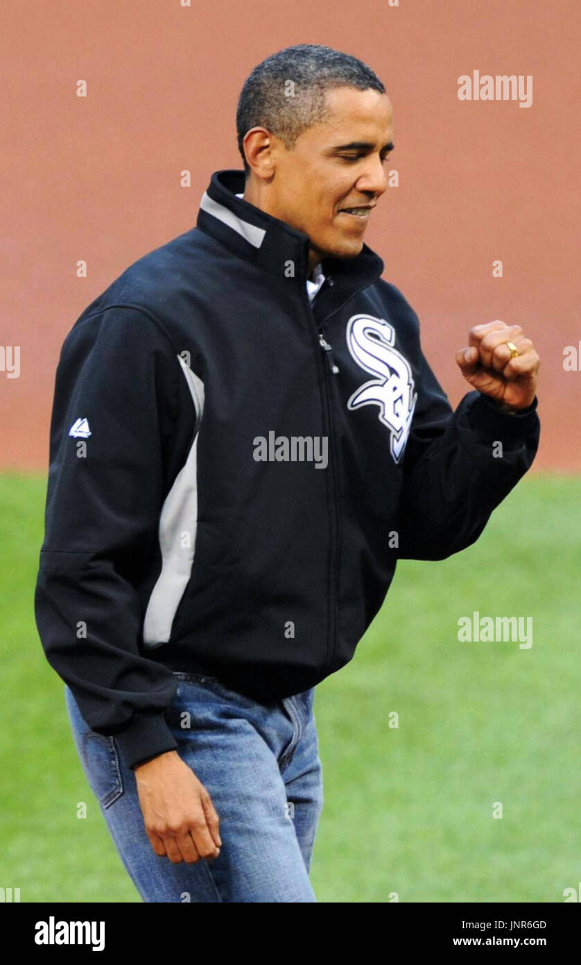 ST. LOUIS, Missouri - U.S. President Barack Obama reacts after throwing ...