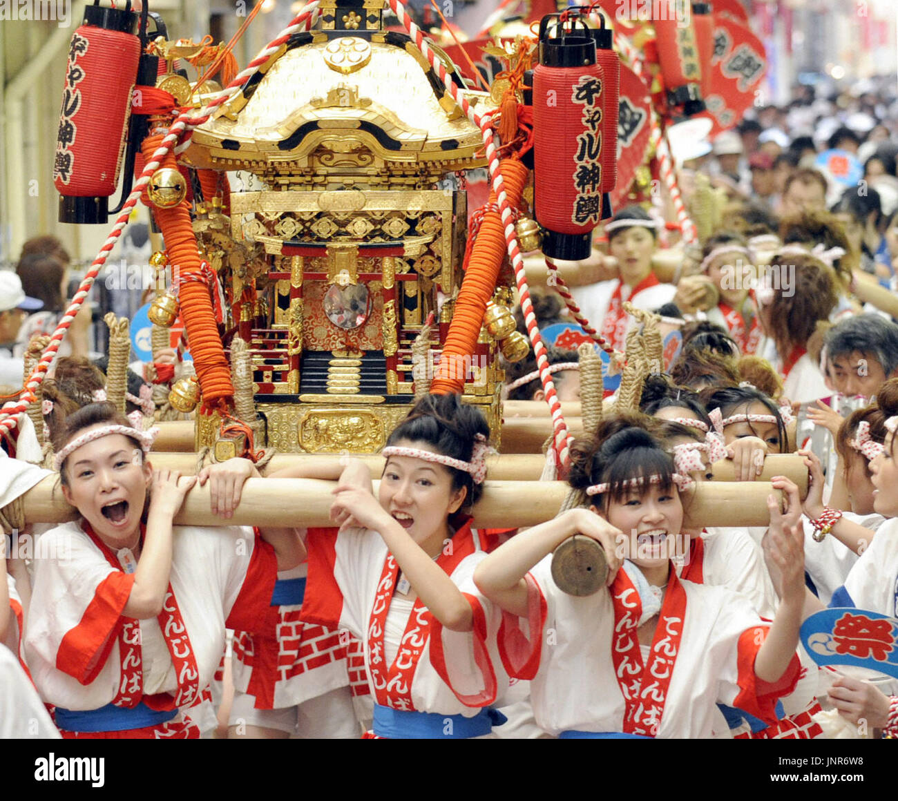OSAKA, Japan - Women aged between 16 and 39 carry a portable shrine ...