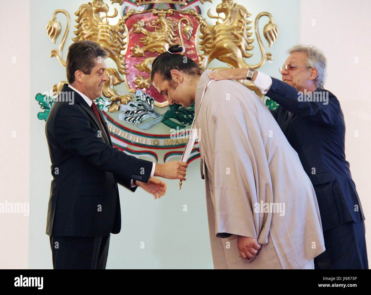 SOFIA, Bulgaria - Bulgaria-born sumo wrestler Kotooshu (R) is given the ...