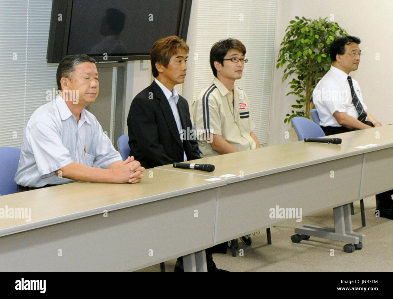 SAITAMA, Japan - Three lay judges, including Kenji Kikuchi (2nd from R ...