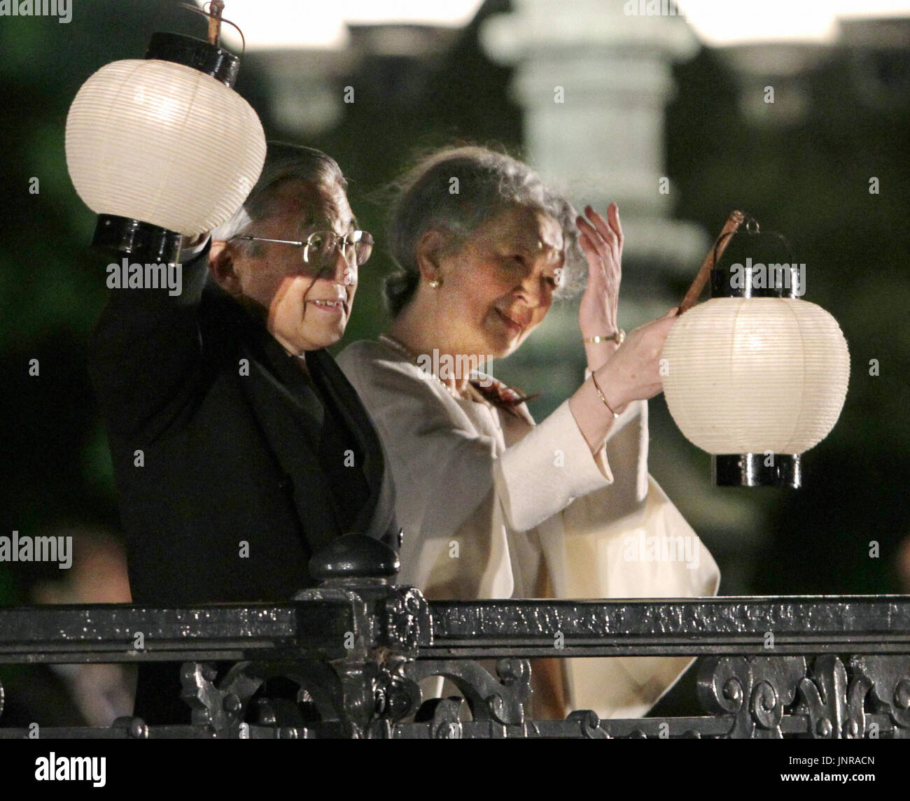 TOKYO, Japan - Emperor Akihito and Empress Michiko hold paper lanterns ...