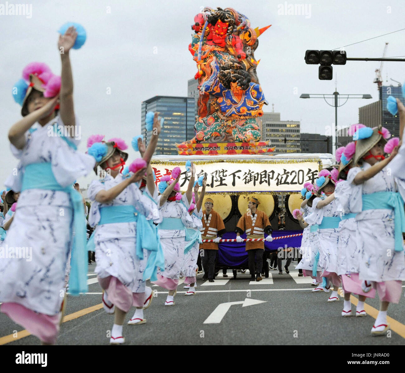 TOKYO, Japan - Women dance during a parade to celebrate the 20th ...