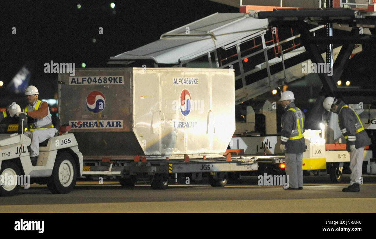 FUKUOKA, Japan - A container carrying the caskets of Japanese victims ...