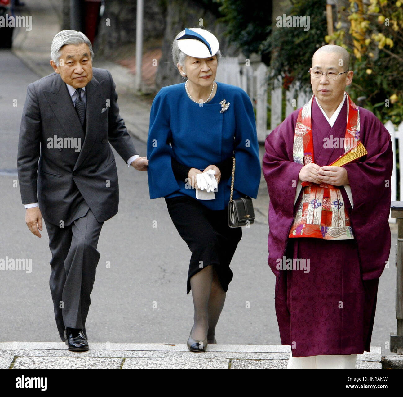 KYOTO, Japan - Emperor Akihito (L) and Empress Michiko (C) follow a nun ...