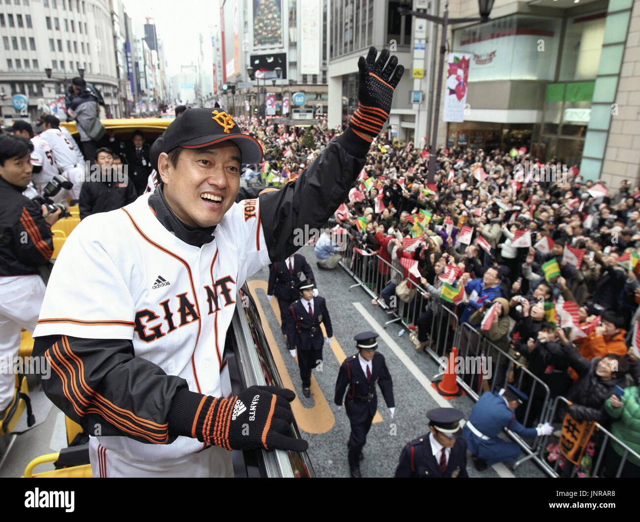 TOKYO, Japan - Yomiuri Giants manager Tatsunori Hara acknowledges the crowd during a victory ...