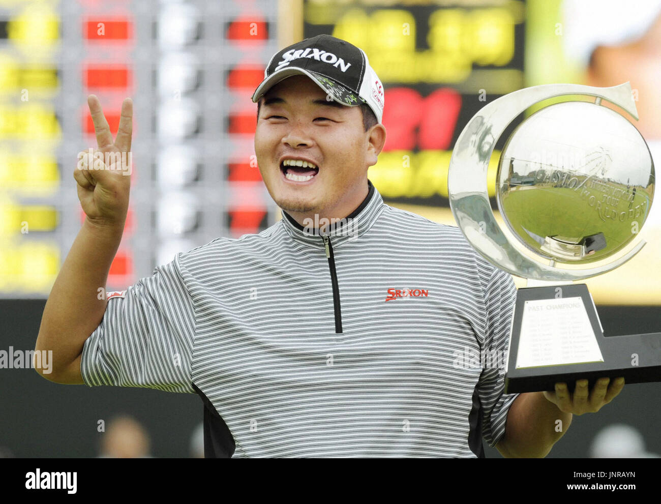KOCHI, Japan - Komei Oda poses with the winner's trophy after winning ...