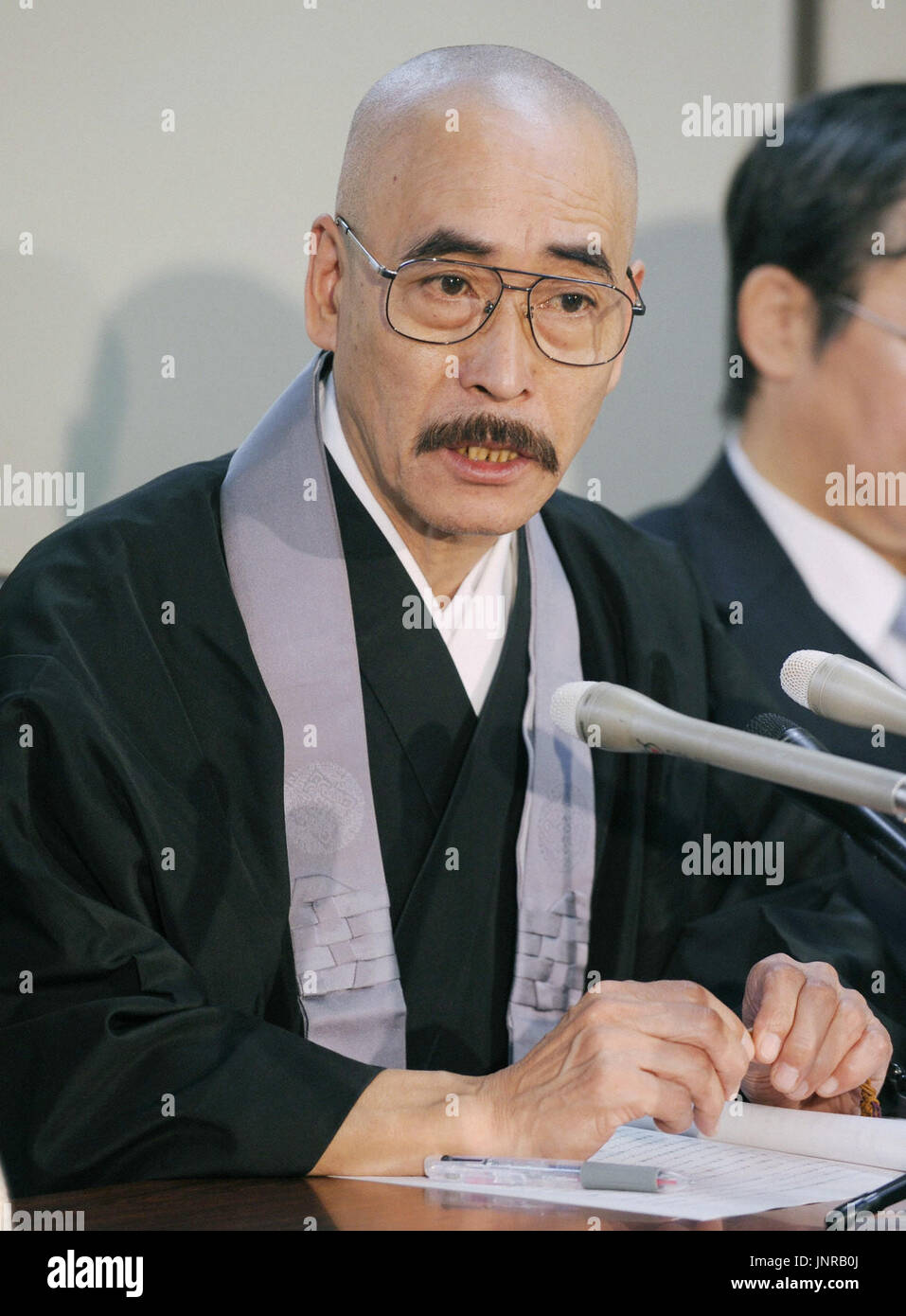 TOKYO, Japan - Yosei Arakawa (C), a 62-year-old monk who received a ...