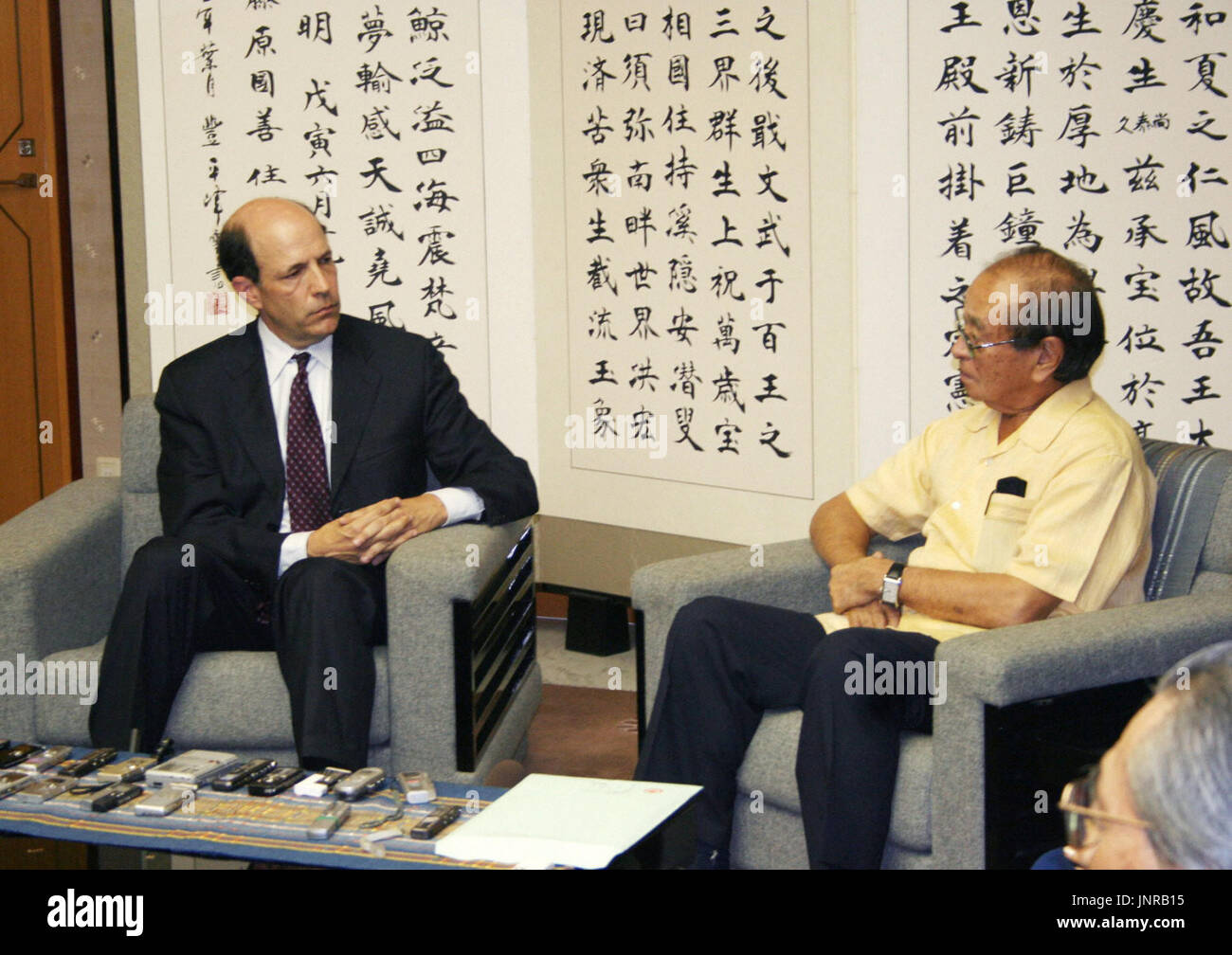 NAHA, Japan - U.S. Ambassador to Japan John Roos (L) meets with Okinawa ...