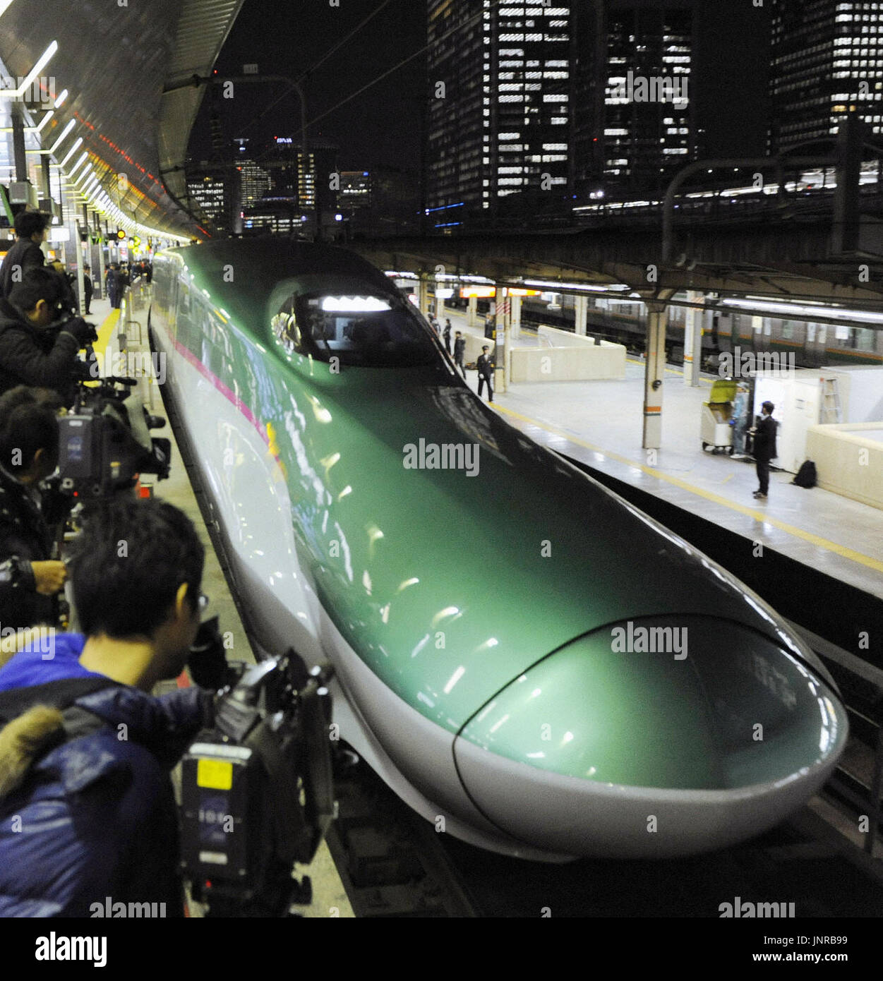 TOKYO, Japan - The E5-type new ''shinkansen'' bullet train pulls in at ...