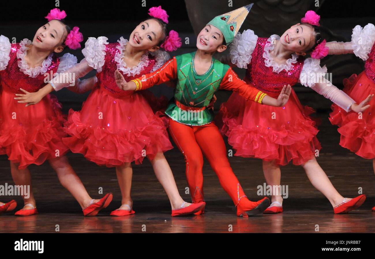 TOKYO, Japan - Children are seen dancing at the after-school academy ...